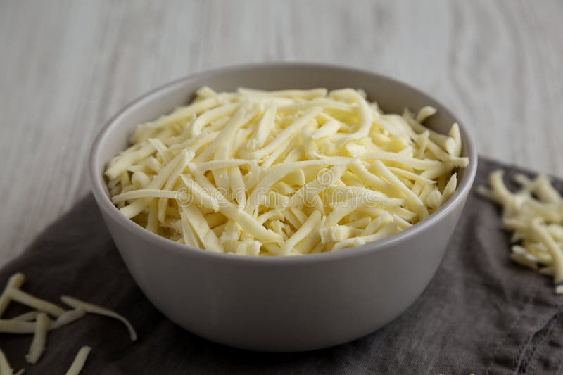 Shredded Mozzarella Cheese in a Bowl, Side View Stock Image - Image of ...