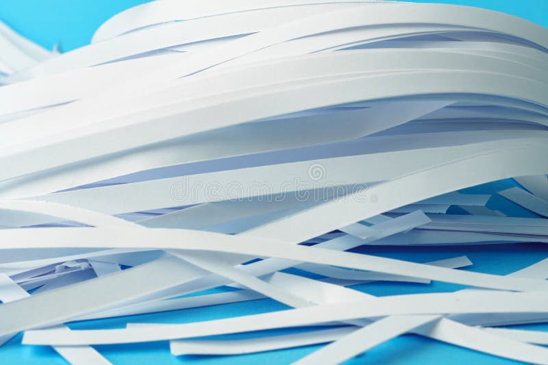 Shredded Paper Pieces on a Blue Background Stock Image - Image of color ...
