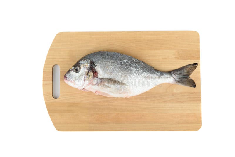 Shredded and Scaled Dorada Fish on a Cutting Board. Stock Photo - Image ...