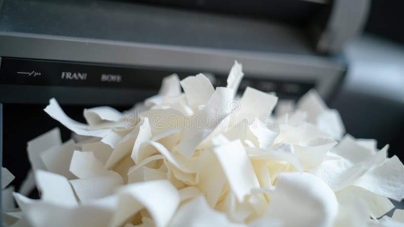 A Shredder Machine is Engaged in Shredding Confidential Documents, with ...