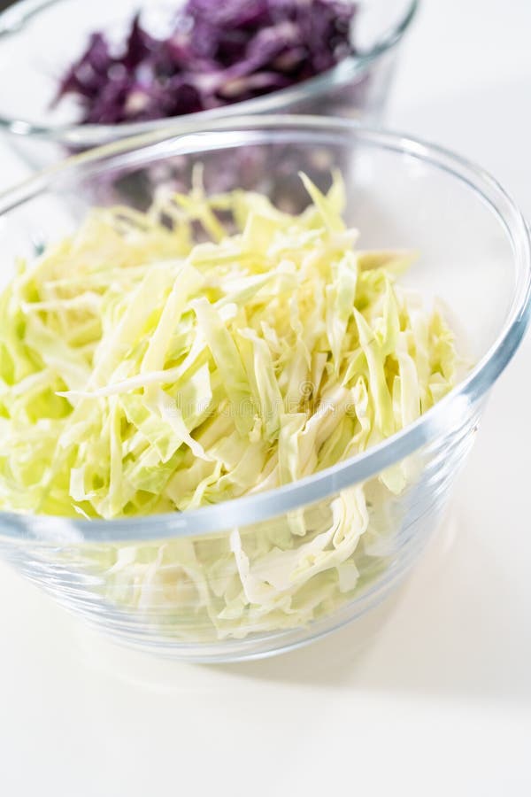 Shredding cabbage stock image. Image of cabbage, preparing - 258707041