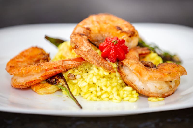 Shrimp Risotto Finely Decorated with Pitanga Fruit (Eugenia Uniflora ...
