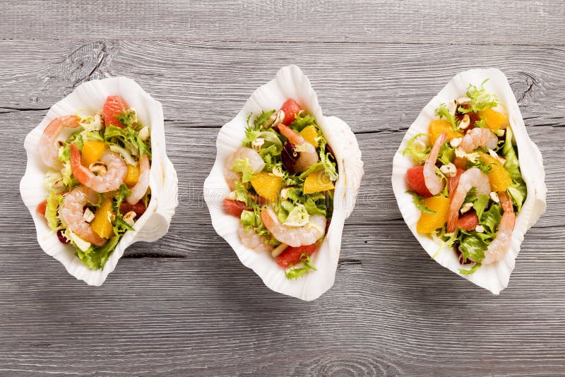 Shrimp salad in sea shells stock image. Image of dinner - 190668755