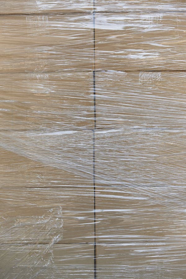 Shrink Wrapping on a Stacked Cardboard Boxes. Delivery Stock Image ...