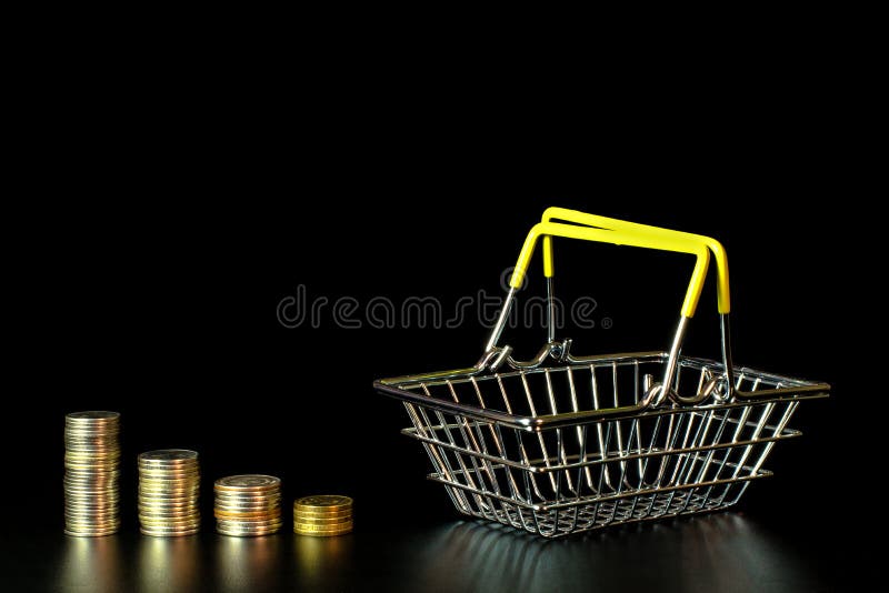 Shrinking Stacks of Coins and an Empty Grocery Basket Stock Photo ...