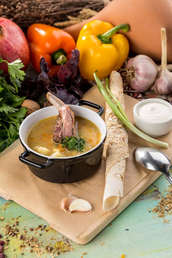Shurpa Soup with Lamb in Pot on Blue Wooden Table Stock Image - Image ...
