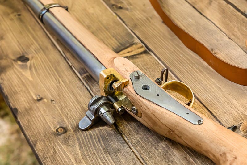 Shutter and Trigger Part of the Old Weapon Close-up on a Wooden Table ...