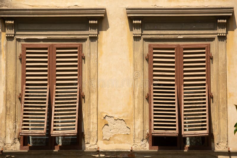 Shuttered Windows on the Exterior of a Building Stock Photo - Image of ...
