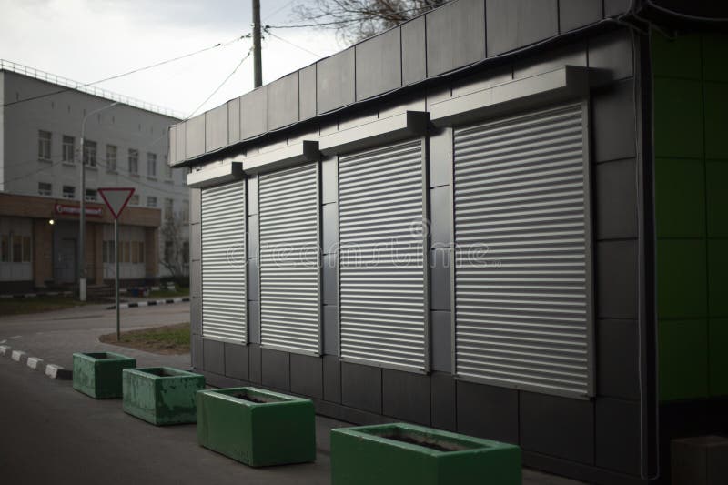 Shutters on Windows. One-storey Office. Sales Building Stock Photo ...