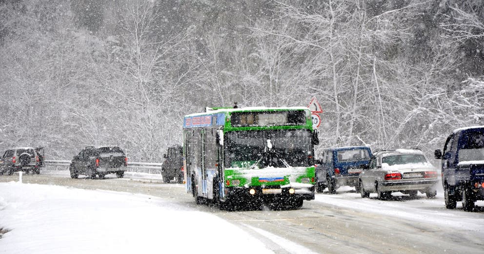 Shuttle Bus on the Road in the Snow Editorial Stock Image - Image of ...