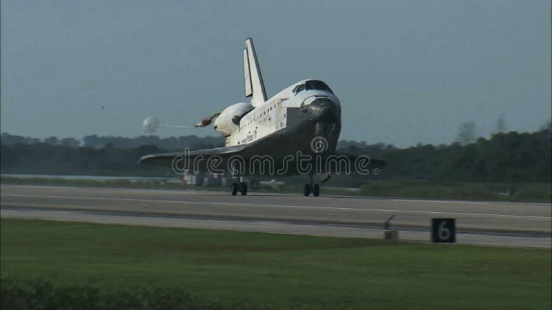 Space Shuttle Landing on Runway and Throws a Parachute Stock Video ...