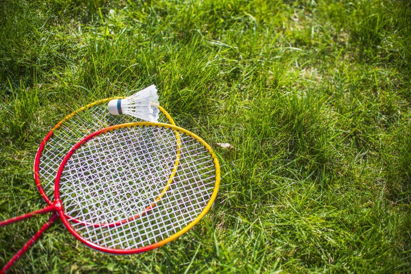 Shuttlecock and Badminton Racket on Grass Stock Photo - Image of ...