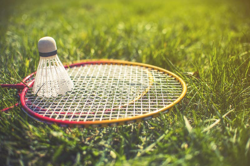 Shuttlecock and Badminton Racket on Grass Stock Photo - Image of ...