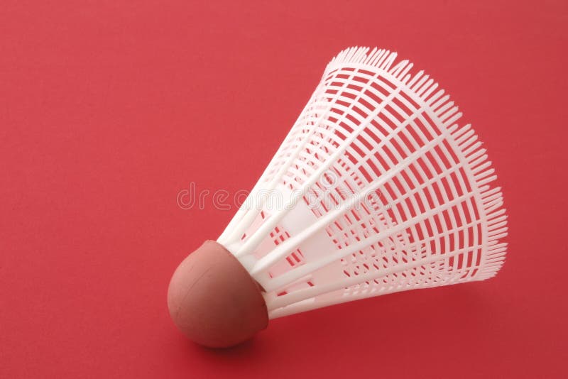 Shuttlecock on red stock photo. Image of gadget, device - 430038