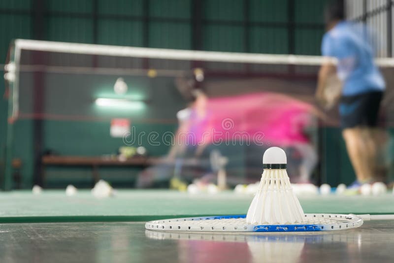 Shuttlecock Resting on a Badminton Racket with Badminton Player are ...