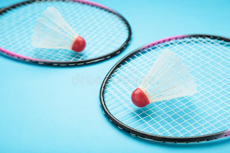Shuttlecocks and Badminton Racket on Blue Background. Badminton ...