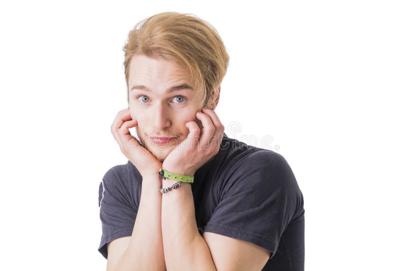 Shy blond man stock image. Image of holding, hands, tshirt - 70445185