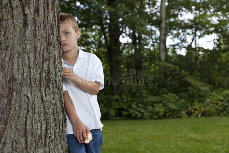 Shy boy stock photo. Image of peeking, peering, lonely - 20821394