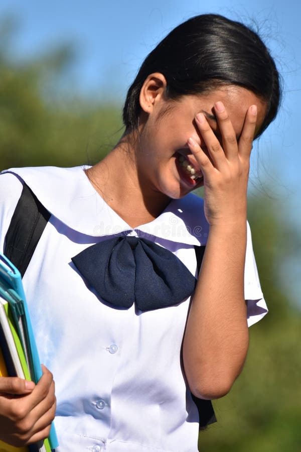 A Shy Female Student Holding Books Stock Image - Image of pupil ...
