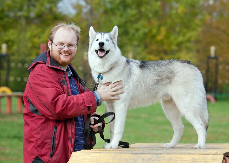 Siberian Husky with a man stock image. Image of people - 16634161