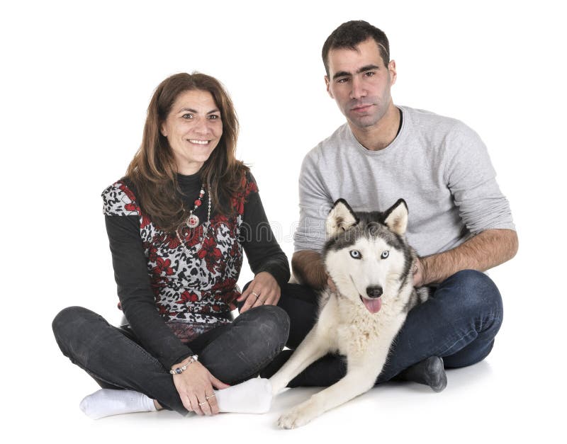 Siberian husky and owners stock photo. Image of animal - 138807334