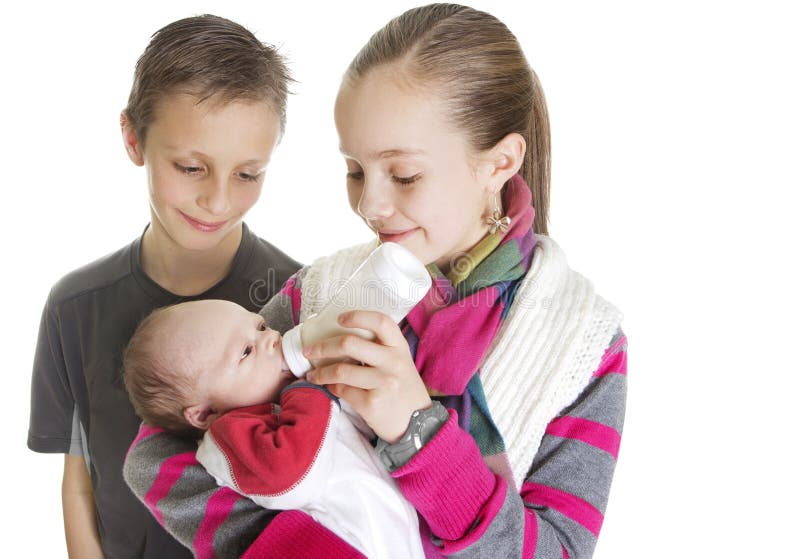 Siblings Caring for Their New Baby Brother Stock Photo - Image of ...