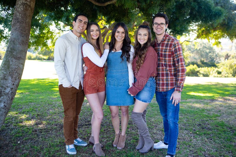 Siblings and Cousins at a Park Stock Image - Image of woman, siblings ...