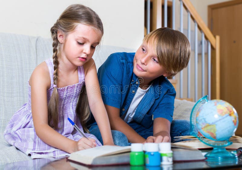 Siblings Doing Ordinary Homework Together Stock Photo - Image of people ...