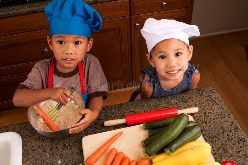 Siblings Eating and Cooking in the Kitchen. Stock Image - Image of love ...