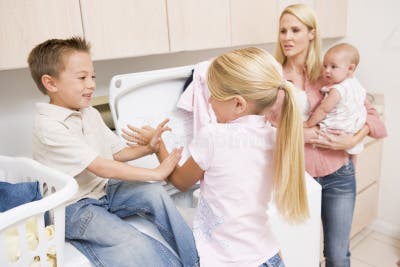 Siblings Fighting while Doing Laundry Stock Image - Image of home ...