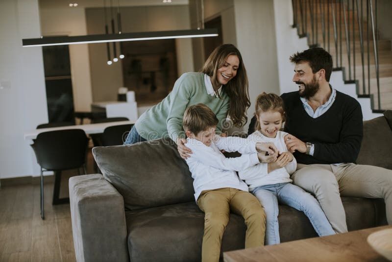 Siblings Fighting Over TV Remote Control at Home Stock Photo - Image of ...