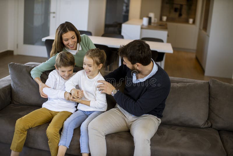 Siblings Fighting Over TV Remote Control at Home Stock Photo - Image of ...