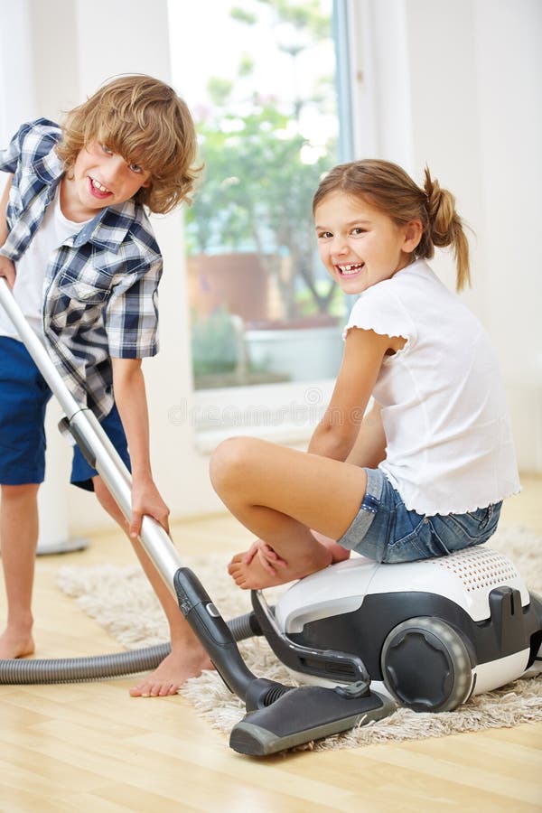 Siblings Having Fun with Vacuum Cleaner Stock Photo - Image of people ...