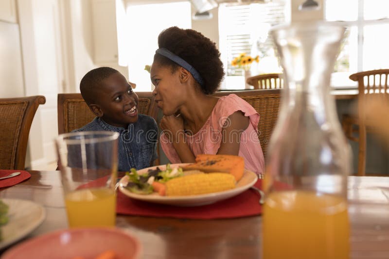 Siblings Interacting with Each Other on Dining Table Stock Photo ...