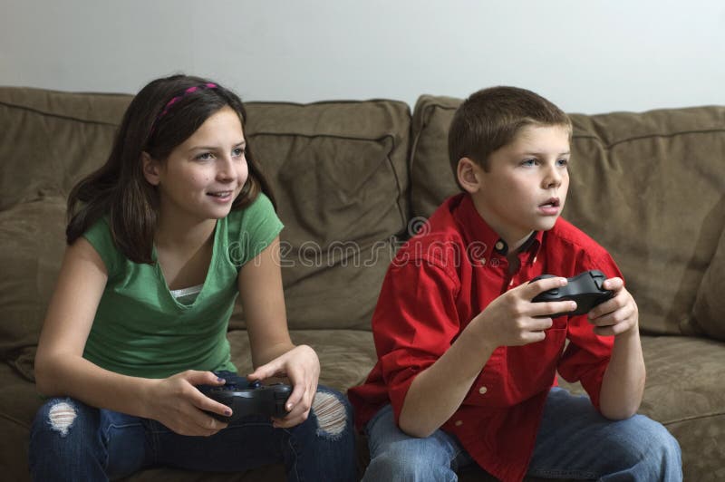 Sister and Brother Playing a Video Game Stock Image - Image of ...