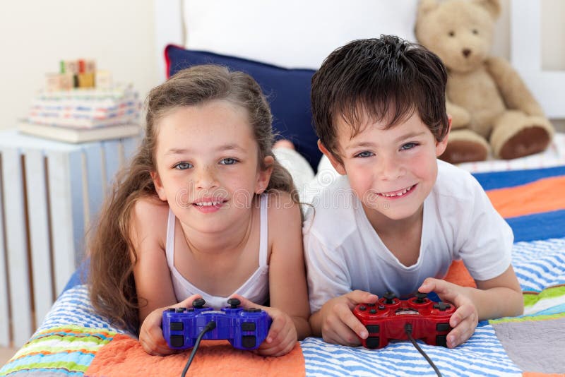 Siblings Playing Video Games Together Stock Photo - Image: 11997202