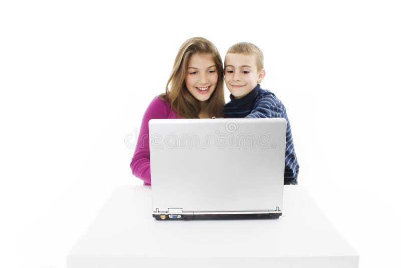 Siblings using computer stock photo. Image of caucasian - 16828942