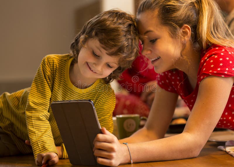 Siblings Using Digital Tablet Stock Photo - Image of game, culture ...