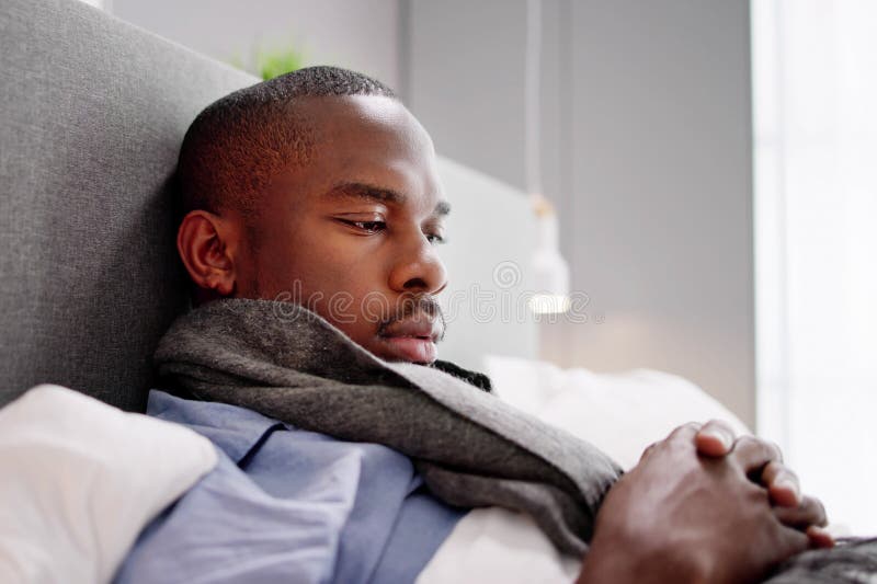 Sick African Man in Bed stock image. Image of african - 281332817