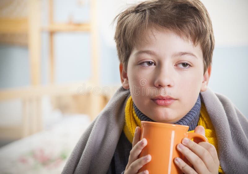 Sick Boy with a Cup of Tea at Home Stock Photo - Image of blowing ...
