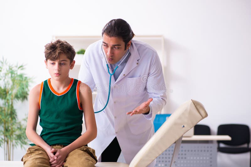 Sick Boy Visiting Young Male Doctor Pediatrician Stock Photo - Image of ...