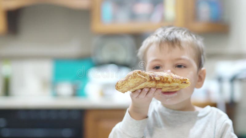 Sick Child Eating Puff in the Kitchen Stock Video - Video of emotion ...
