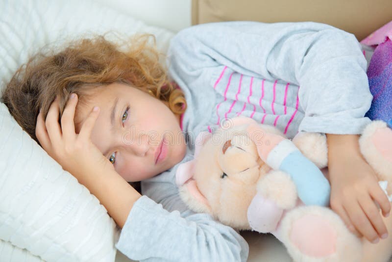 Sick girl on bed stock image. Image of illness, disease - 258797103
