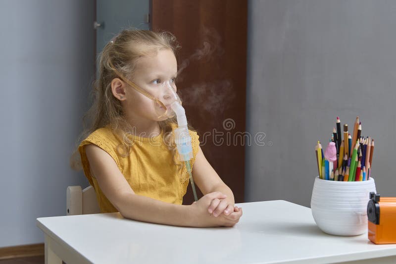 A Sick Girl Breathes Steam from a Nebulizer. Stock Image - Image of ...