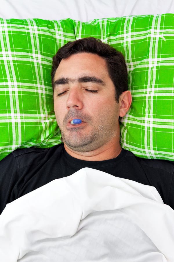 Sick Hispanic Man Laying in Bed with a Thermometer Stock Photo - Image ... Sick Hispanic Man Laying in Bed with a Thermometer Stock Photo - Image ...
