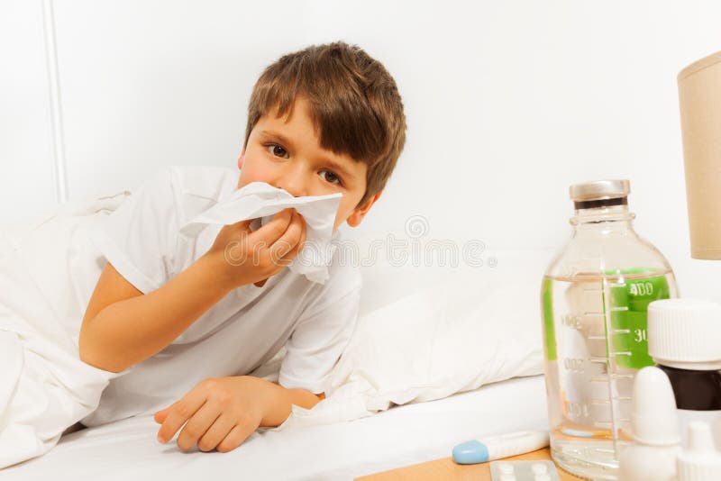 Sick Kid Boy Blowing His Nose with a Napkin Stock Photo - Image of nose ...