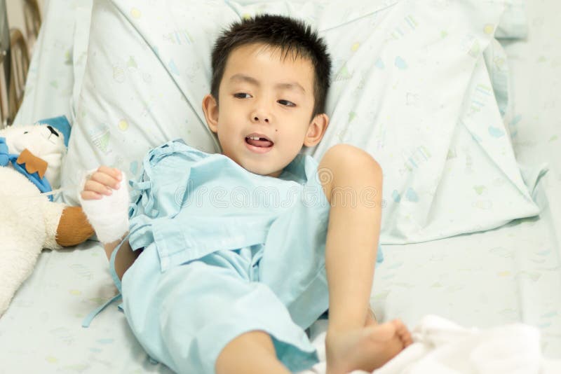 A Sick Little Boy in Hospital Bed. Stock Photo - Image of clean ...