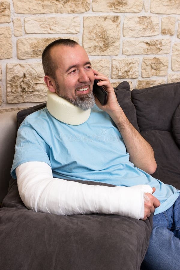 A Sick Man Answering the Phone on a Couch Stock Photo - Image of ruff ...