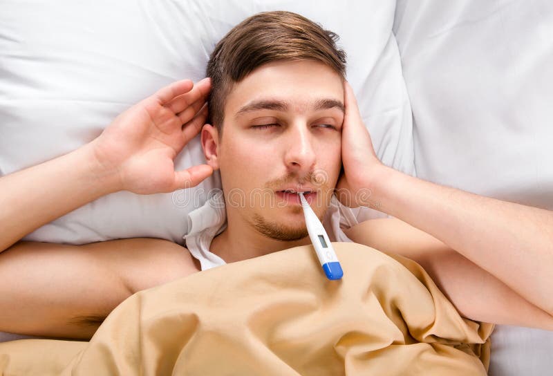 Sick Man in the Bed stock image. Image of handsome, measure - 168524679