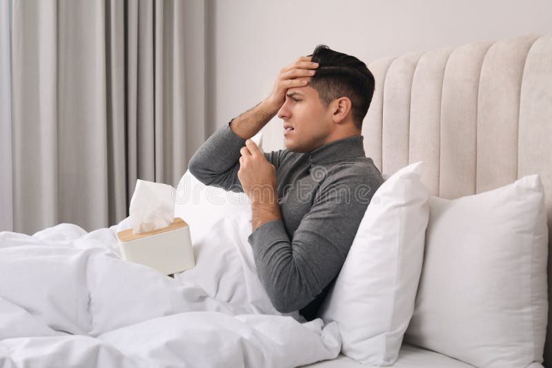 Sick Man with Box of Paper Tissues Suffering from Cold in Bed at Home ...